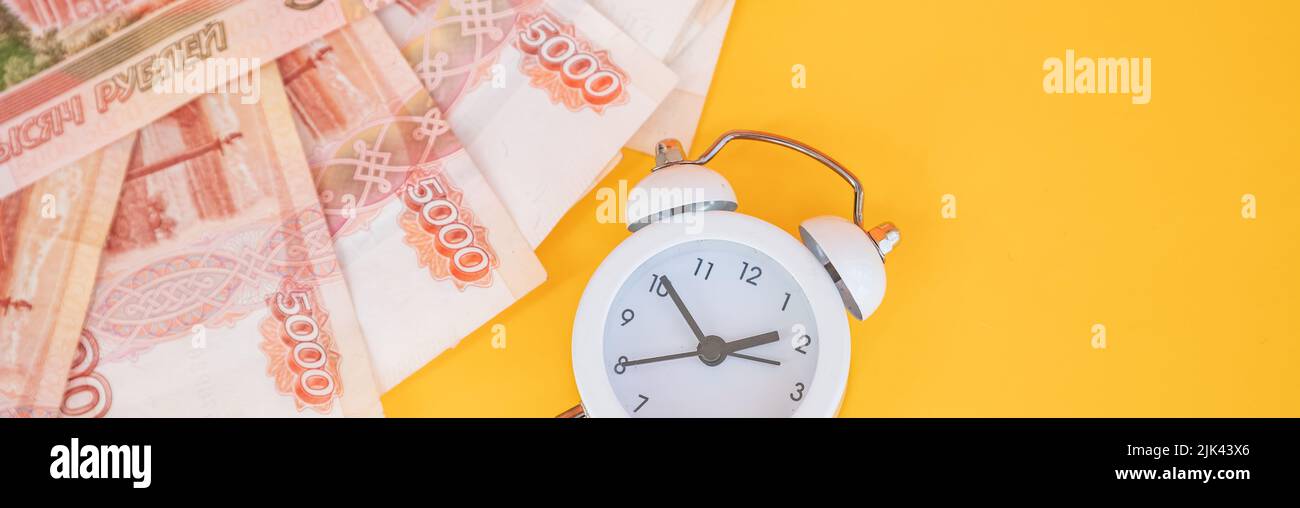 Time value of money concept, analog clock on US dollar banknote ...