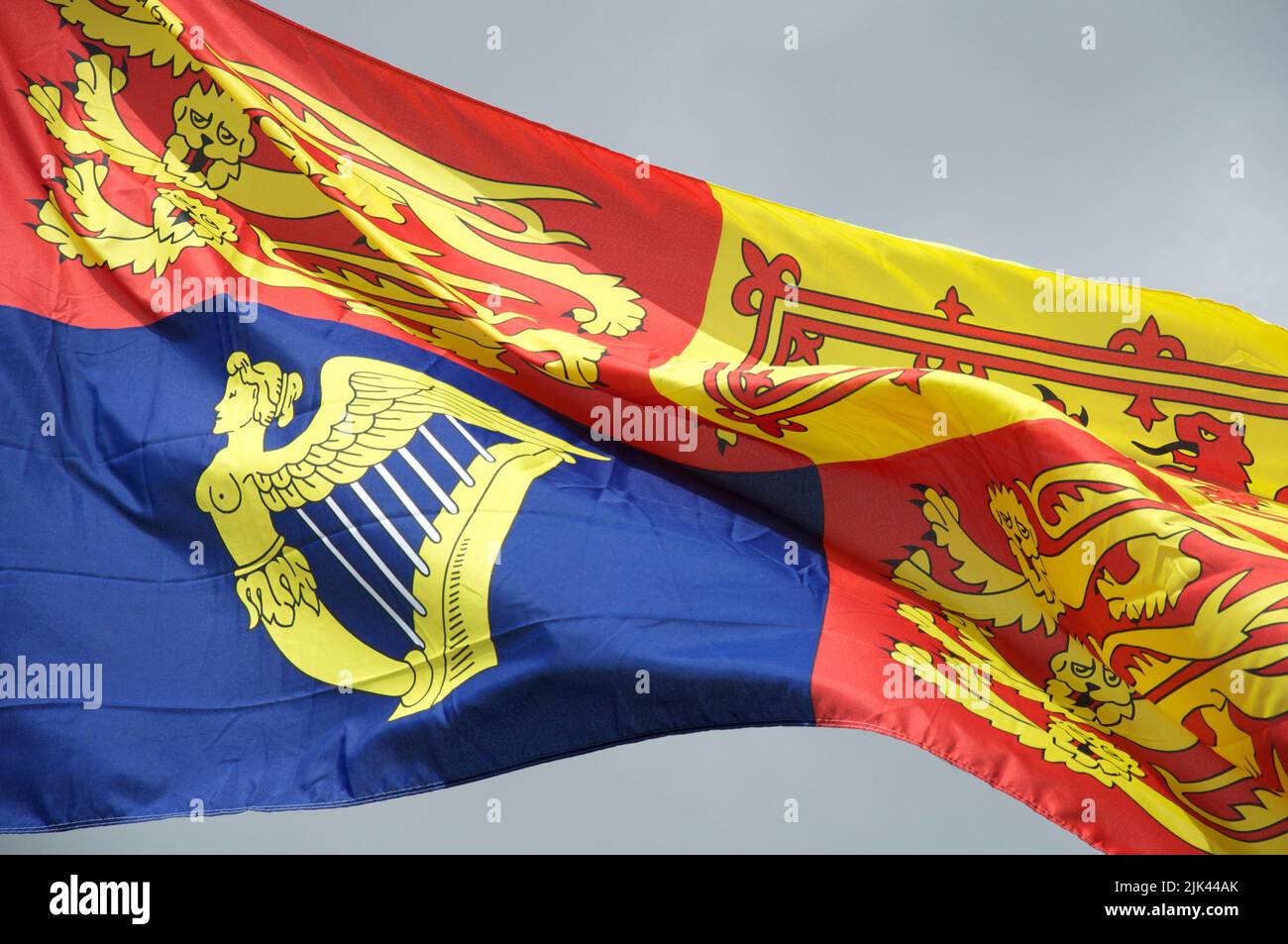Heraldic flag. The Royal Standard of the United Kingdom blows in the ...
