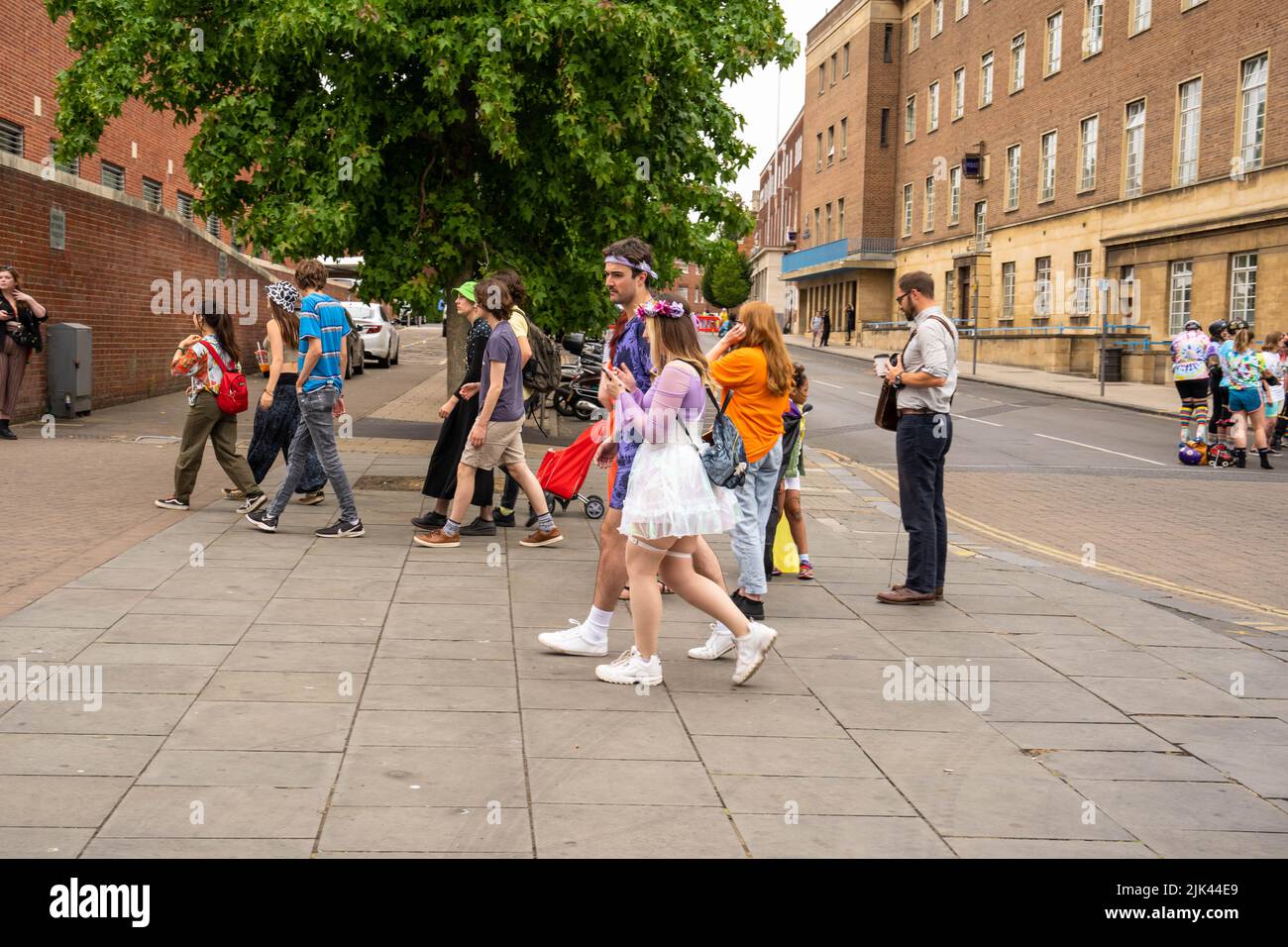 People standing around him hi-res stock photography and images - Alamy
