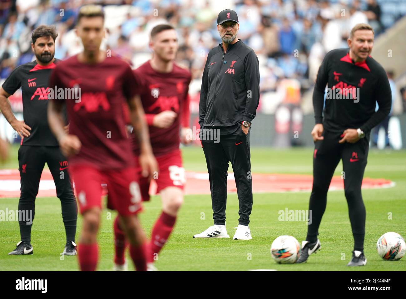 Liverpool manager Jurgen Klopp (centre-right) watching his team warming ...