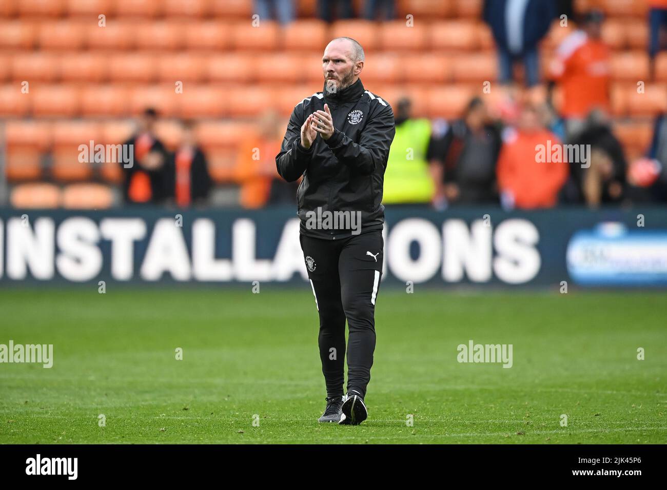 Michael Appleton manager of Blackpool applauds the fans at the end of ...
