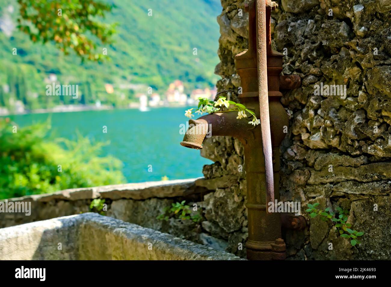 Ancient drinking trough with lever fountain Stock Photo - Alamy