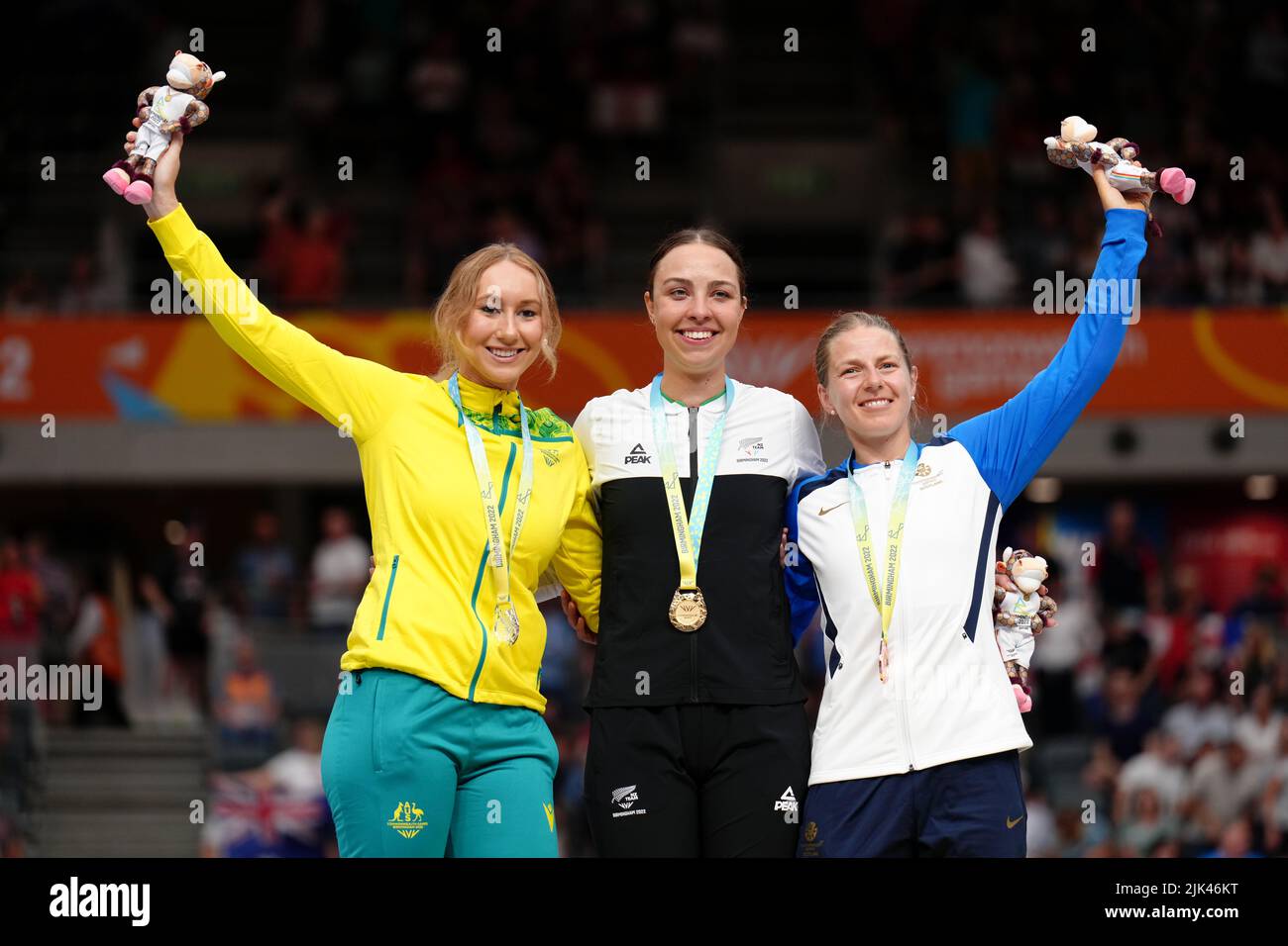 New Zealand's Bryony Botha (centre) poses with her gold medal after ...