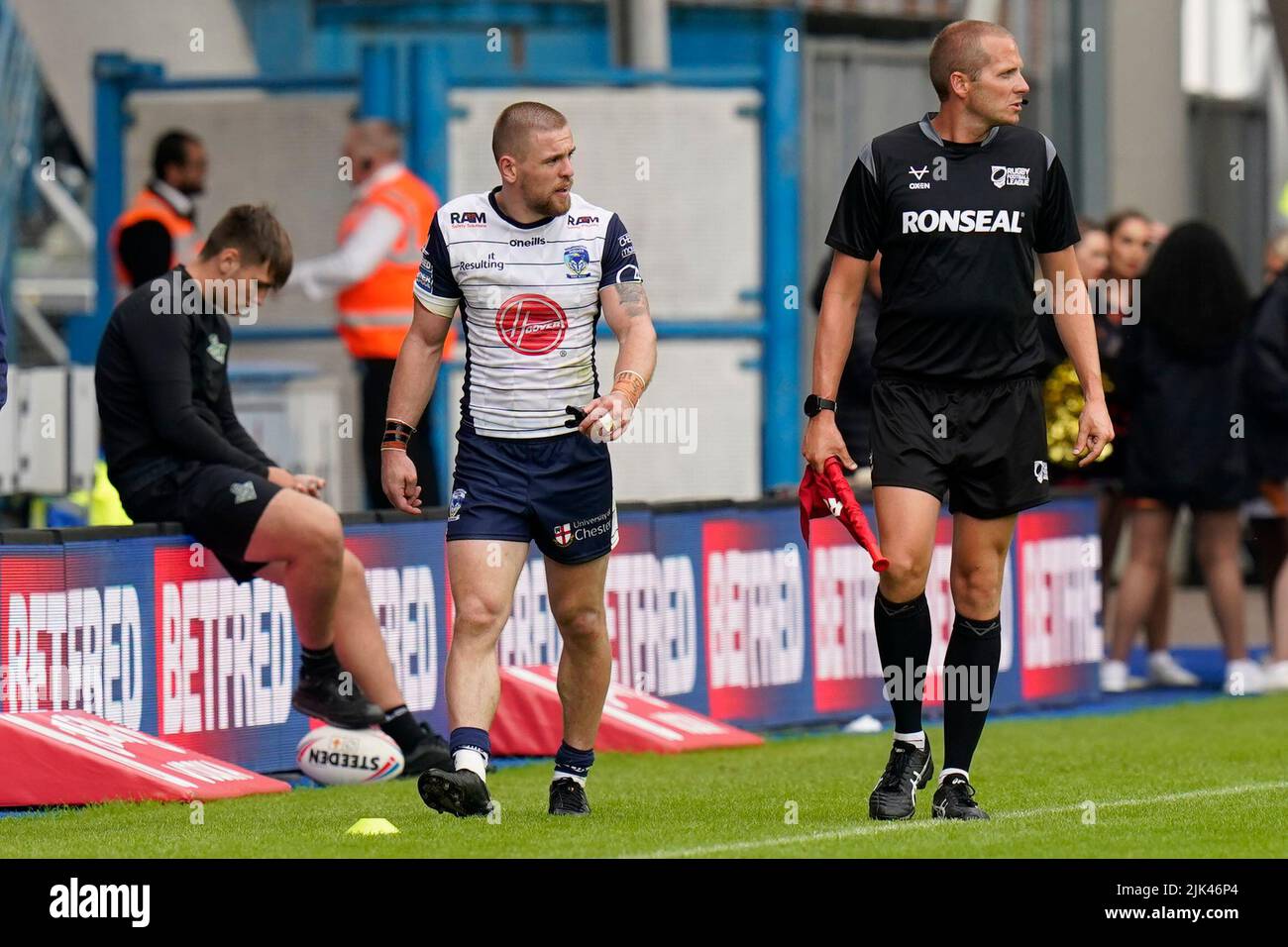 Matt Dufty #36 of Warrington Wolves limps off the pitch after injuring ...