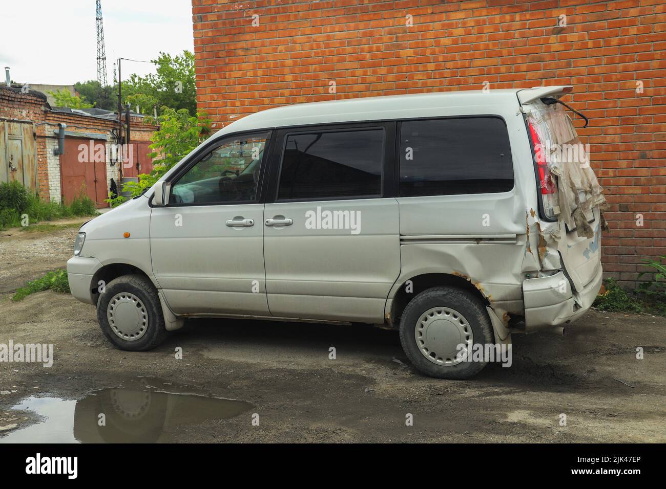 Rusty old minivan in the industrial area Stock Photo - Alamy