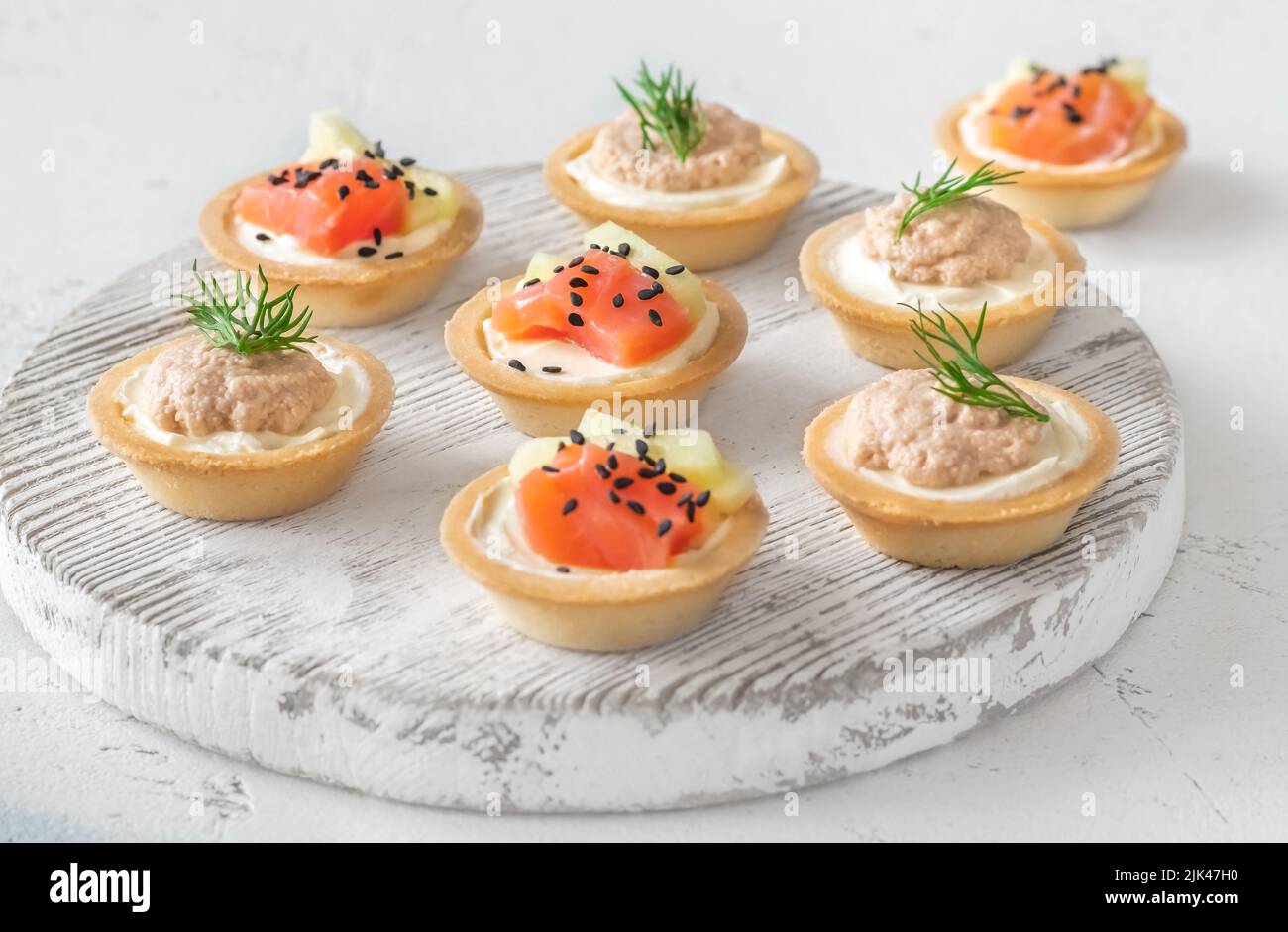 Canapes with cream cheese, cod roe and salmon Stock Photo - Alamy