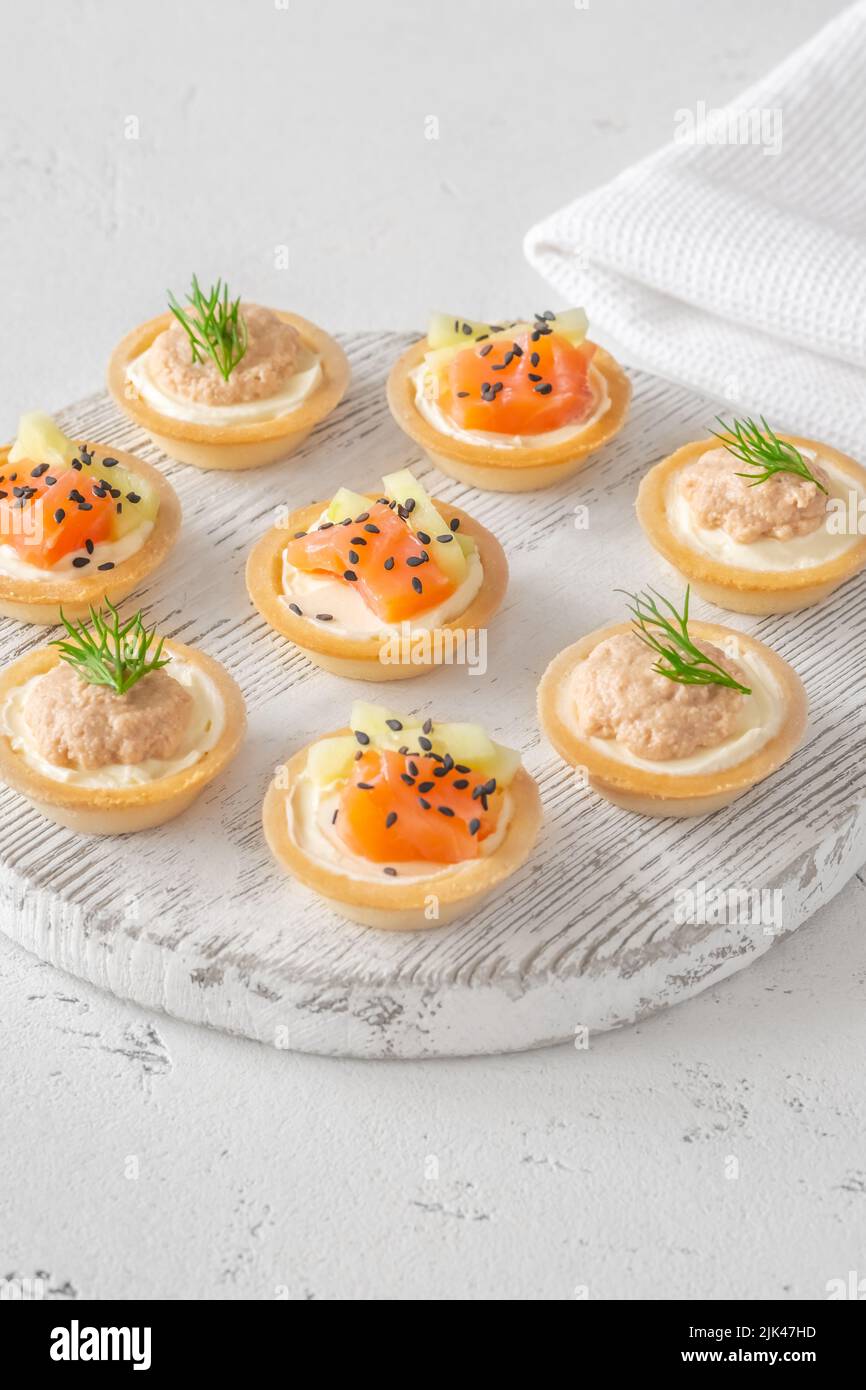 Canapes with cream cheese, cod roe and salmon Stock Photo - Alamy
