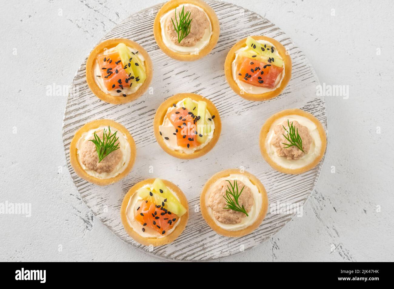 Canapes with cream cheese, cod roe and salmon Stock Photo - Alamy