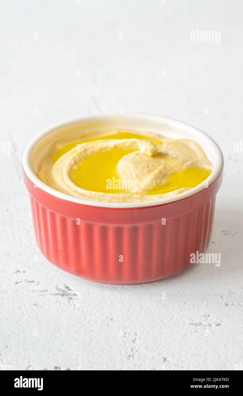 Bowl of hummus garnished with olive oil Stock Photo - Alamy