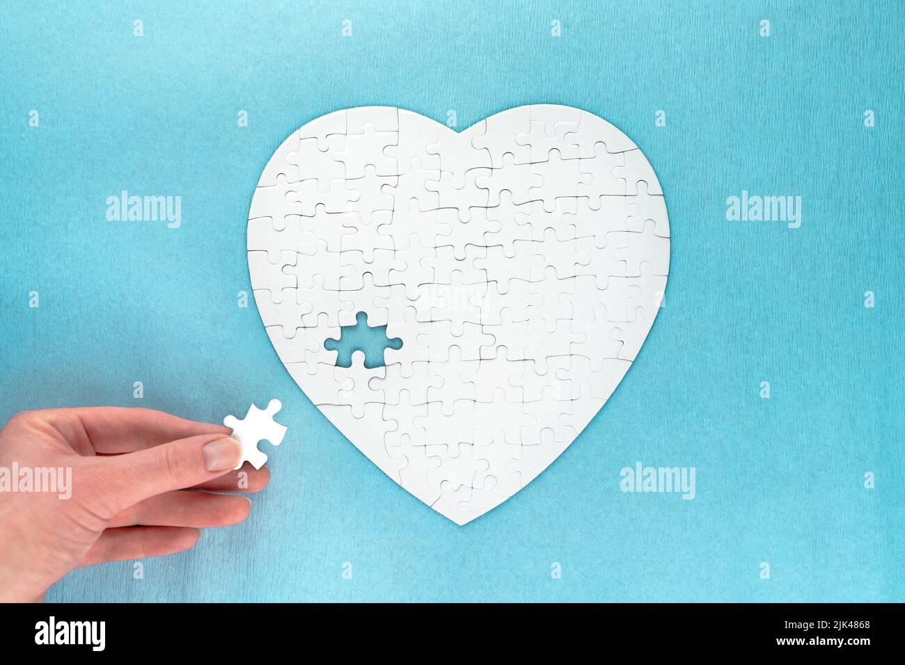 Jigsaw puzzles in heart hi-res stock photography and images - Alamy