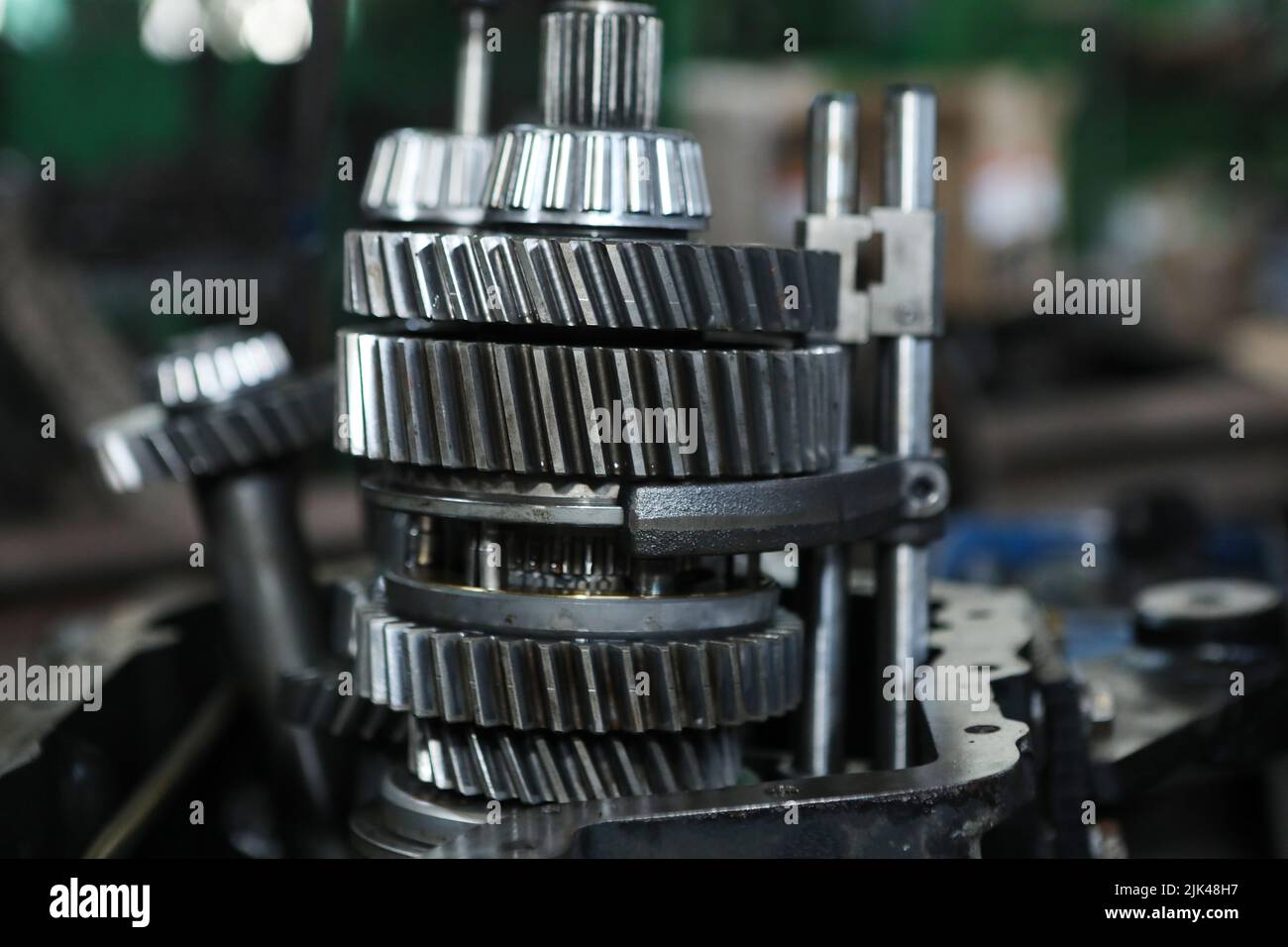 Large gears of a truck. The engine and shaft with gears are ...