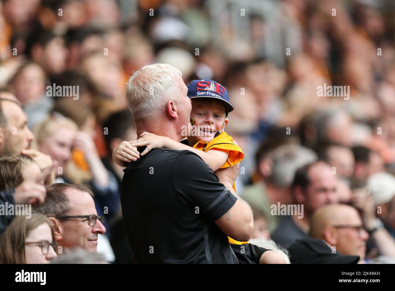 A young Hull City fan and his dad seen in the stands Stock Photo - Alamy