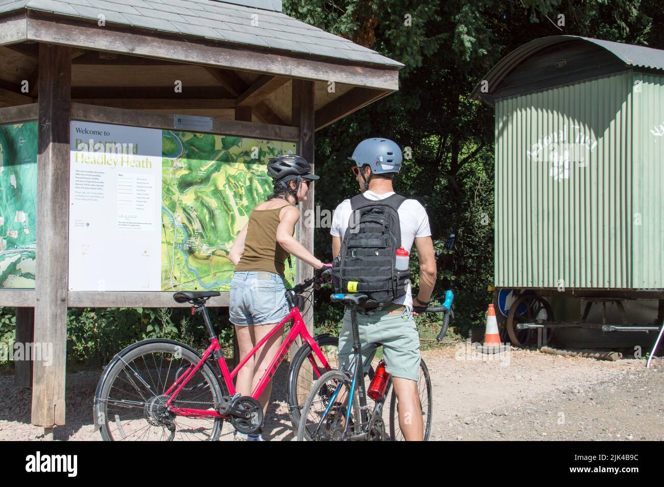 Cyclists checking maps on Surrey hills Stock Photo - Alamy