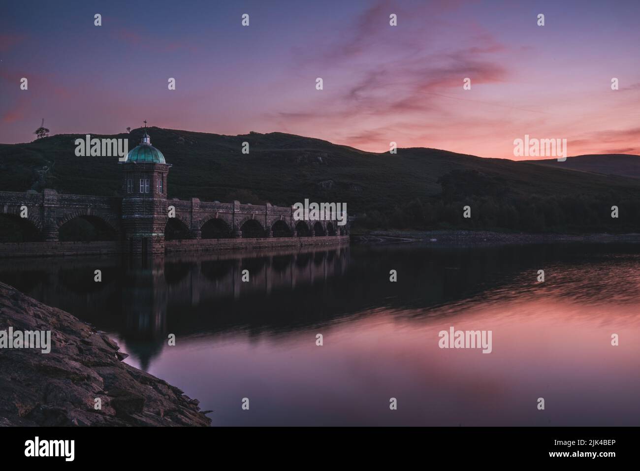 The sun setting on Craig Goch Dam in Elan Valley, Rhayader Powys Stock ...