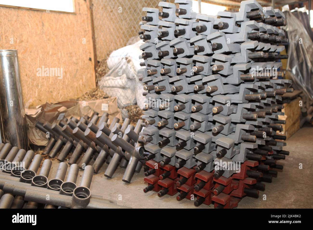 Lots of parts for big cars. Gears, shafts, sprockets in large ...