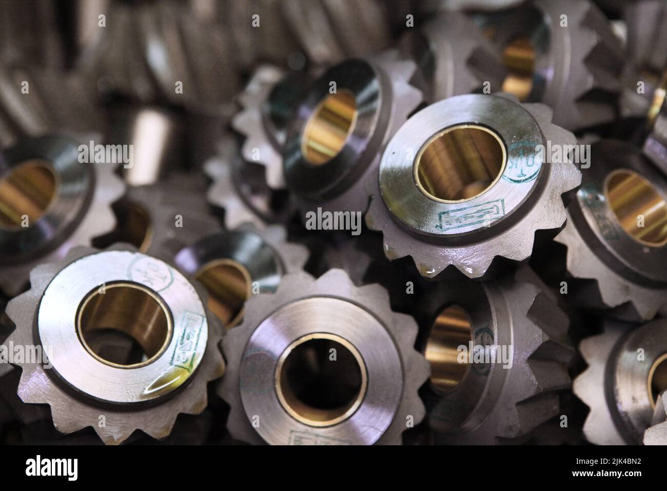 Lots of parts for big cars. Gears, shafts, sprockets in large ...