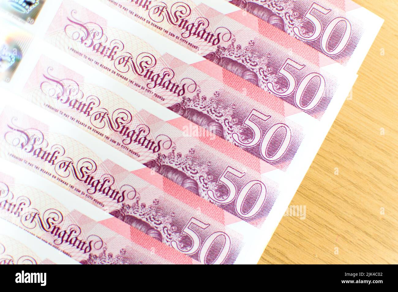 Sterling cash denominations of 50 laid on a table Stock Photo - Alamy
