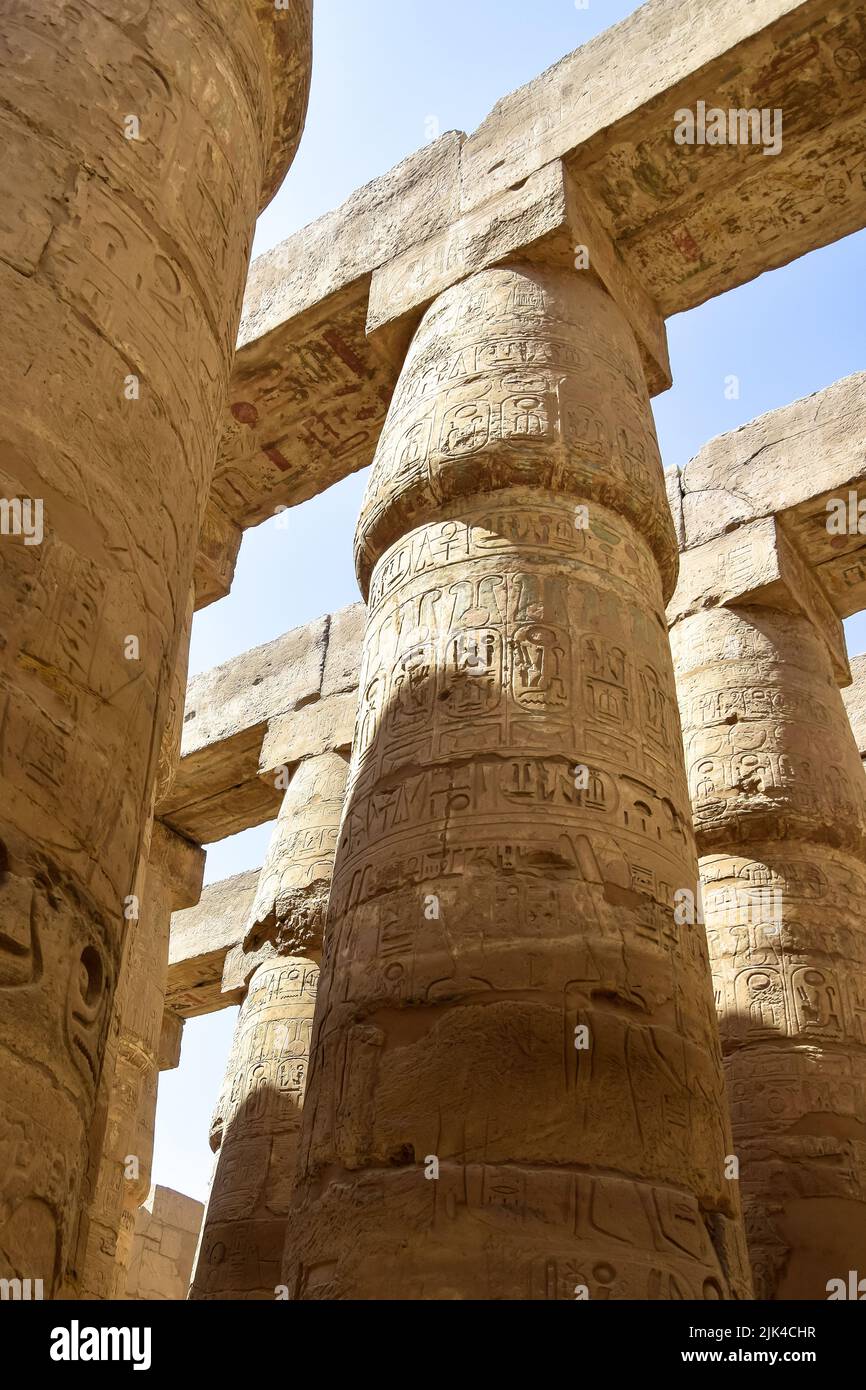 High columns of historical complex of Karnak temple with carved ancient ...