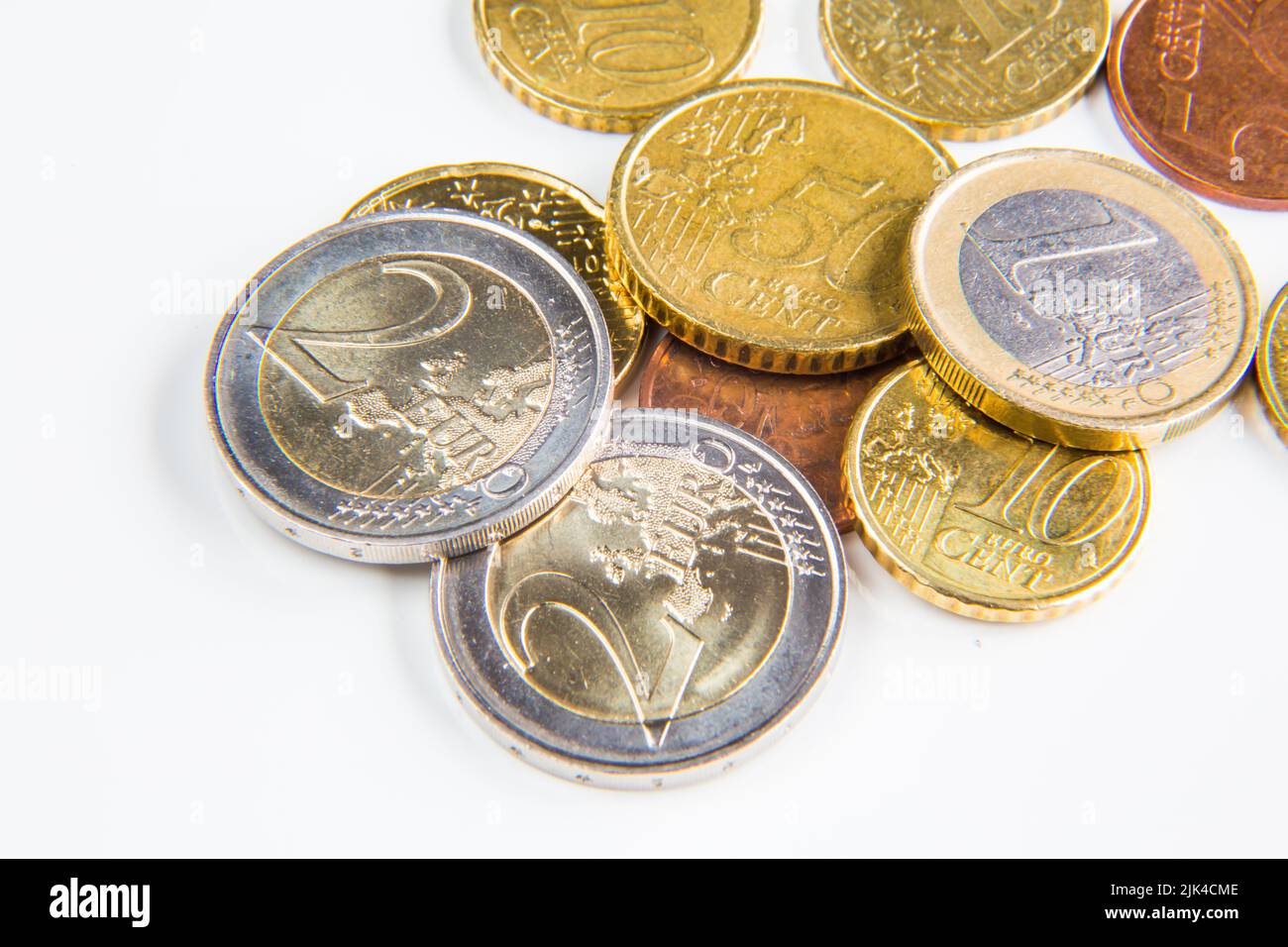 Close up different euro coins on the white background Stock Photo - Alamy