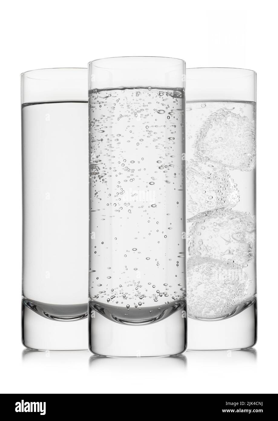 Sparkling and still mineral water with ice cubes and bubbles on white in highball glasses Stock ...