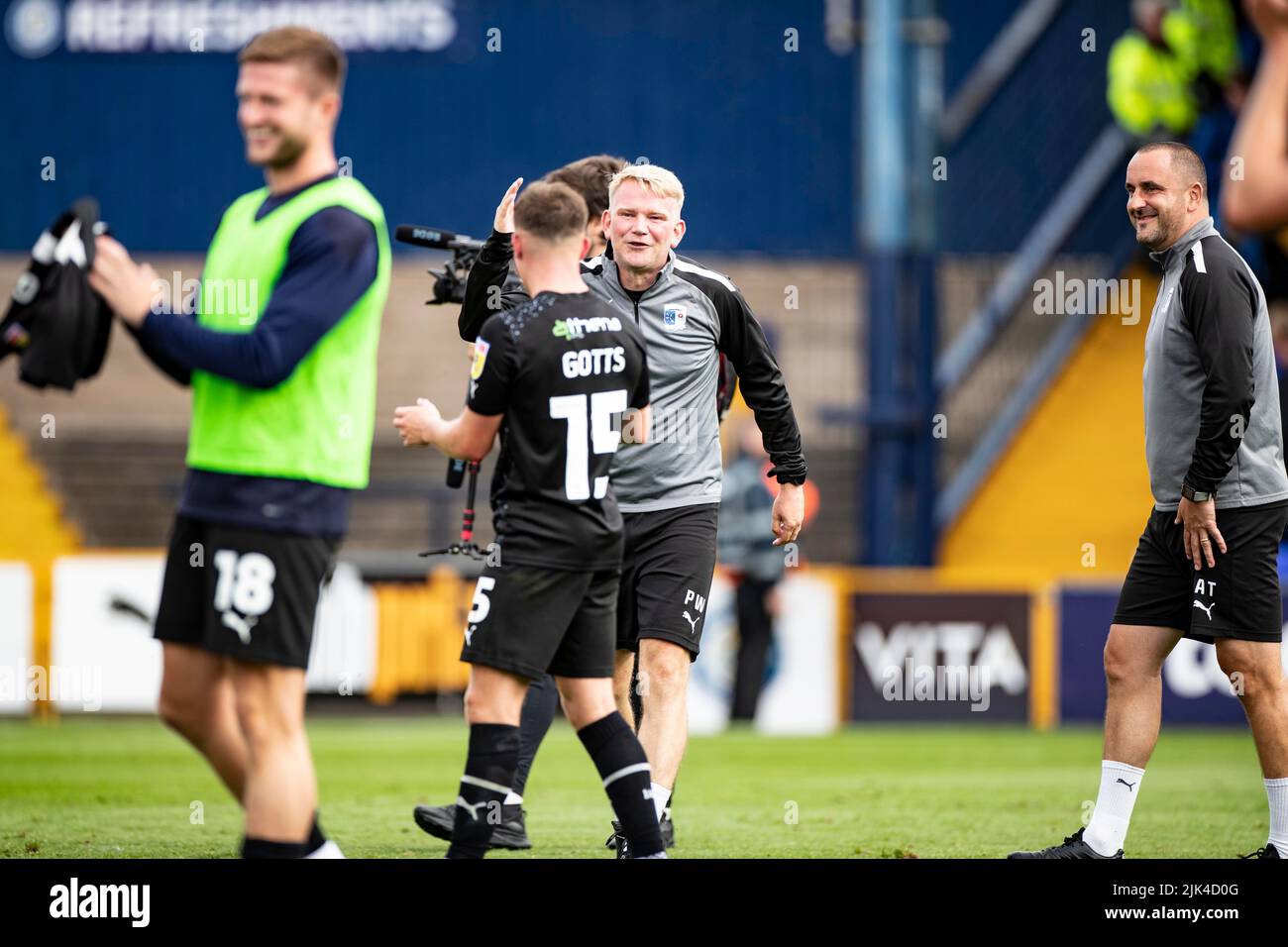 Stockport, UK. 30th July, 2022. Barrow AFC Manager Pete Wild celebrates ...
