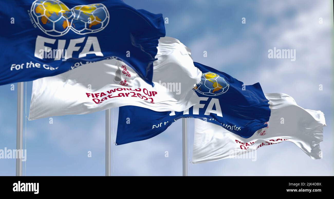 Doha, Qatar, April 2022: Flags with Qatar 2022 World Cup logo and FIFA ...