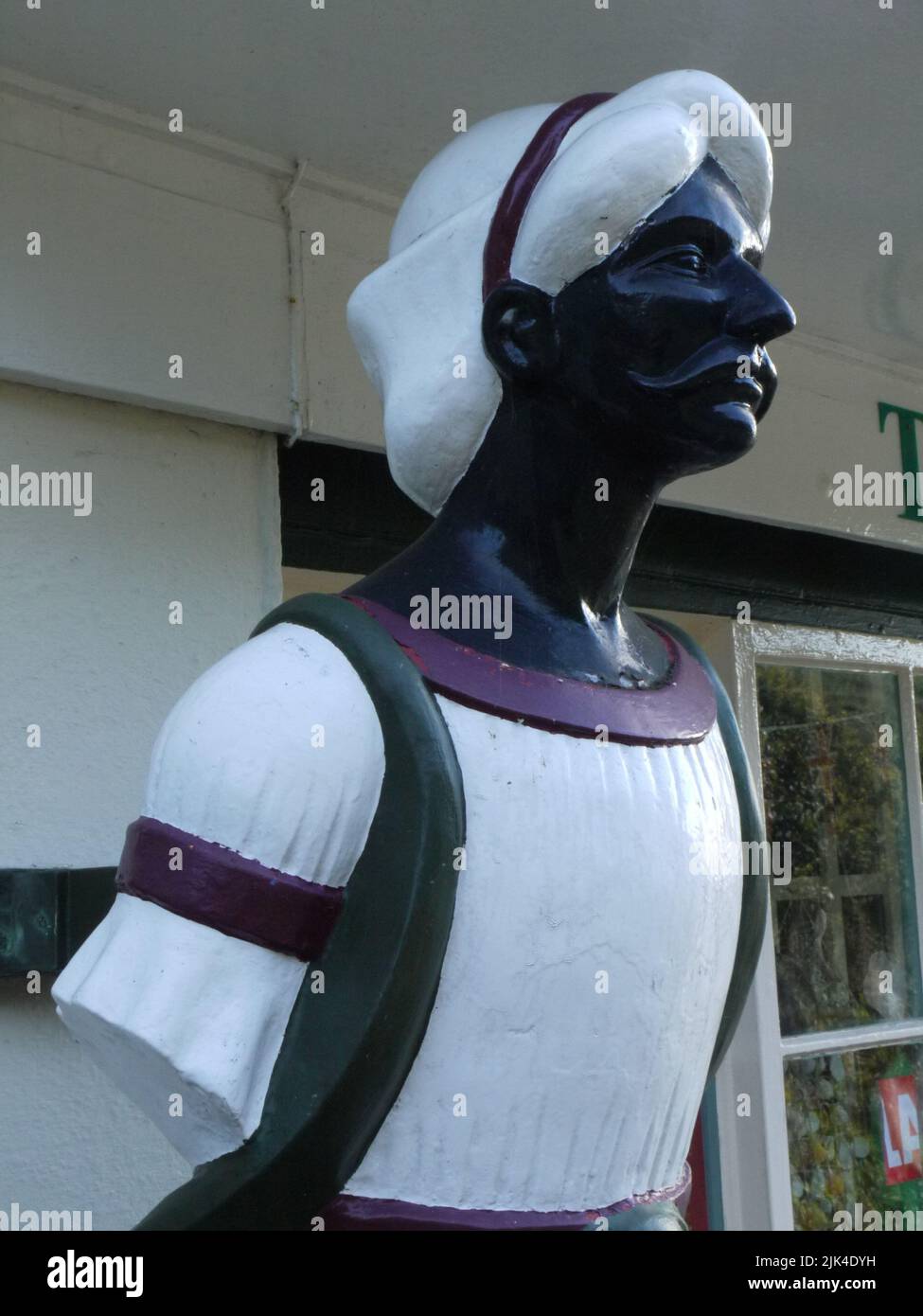 Non-binary ships figurehead with mustache outside The Potters Wheel in ...