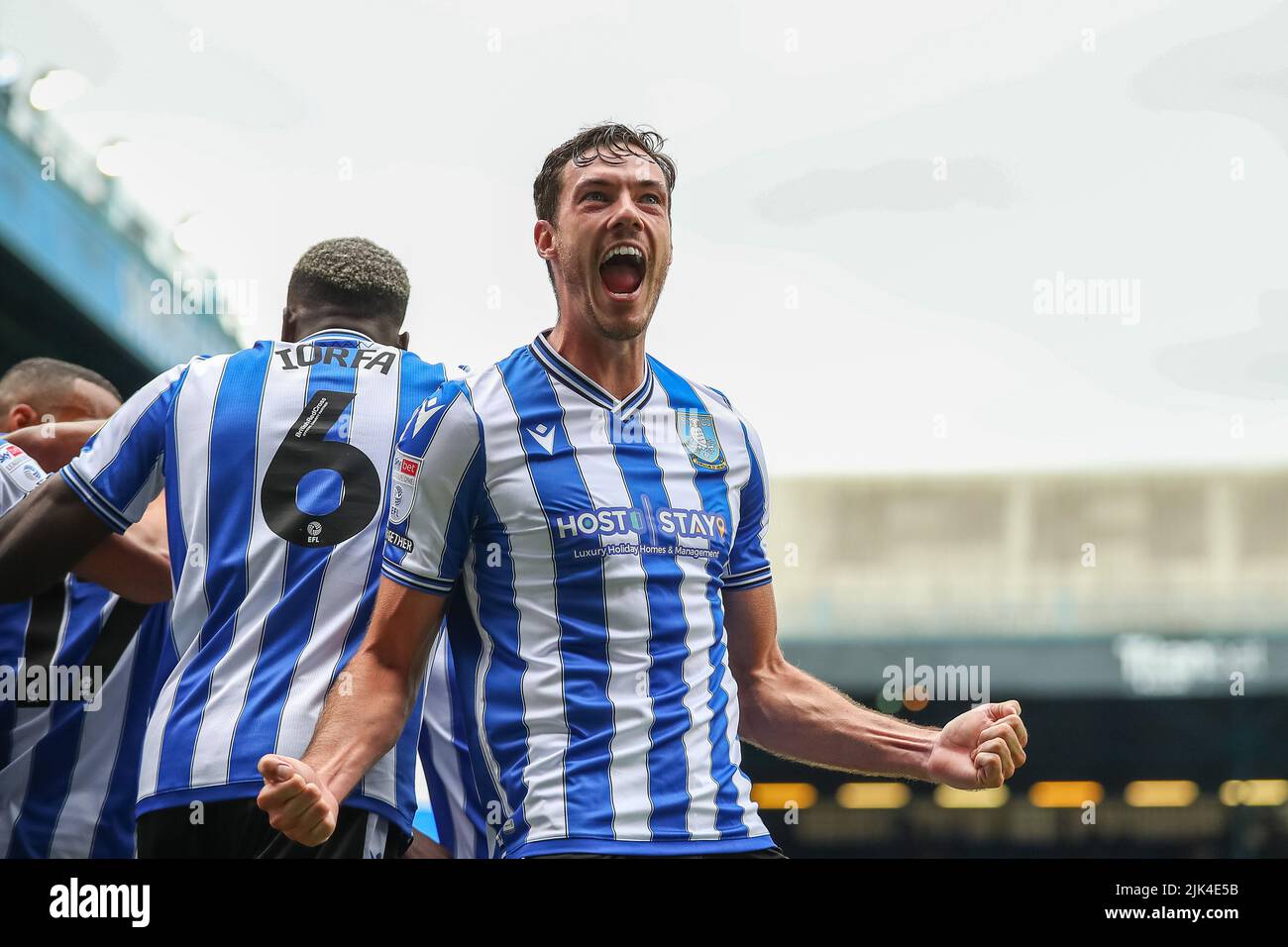 Ben Heneghan #5 of Sheffield Wednesday celebrates Fisayo Dele-Bashiru ...