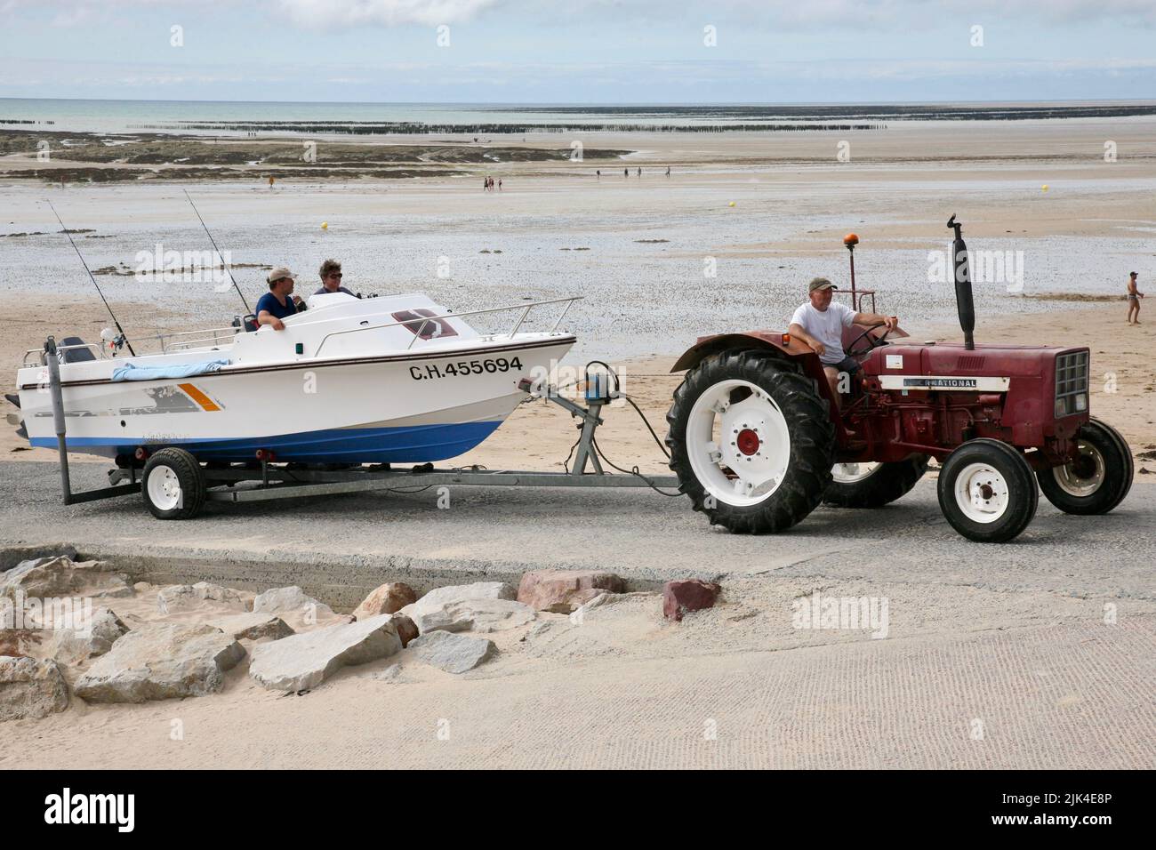 Towing a speedboat off the beach at Pirou Plage, Normandy, France ...