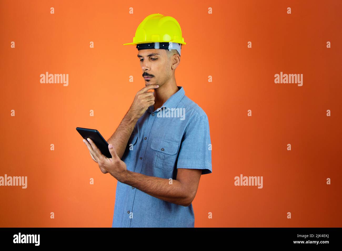 Young engineer orange helmet hi-res stock photography and images - Alamy