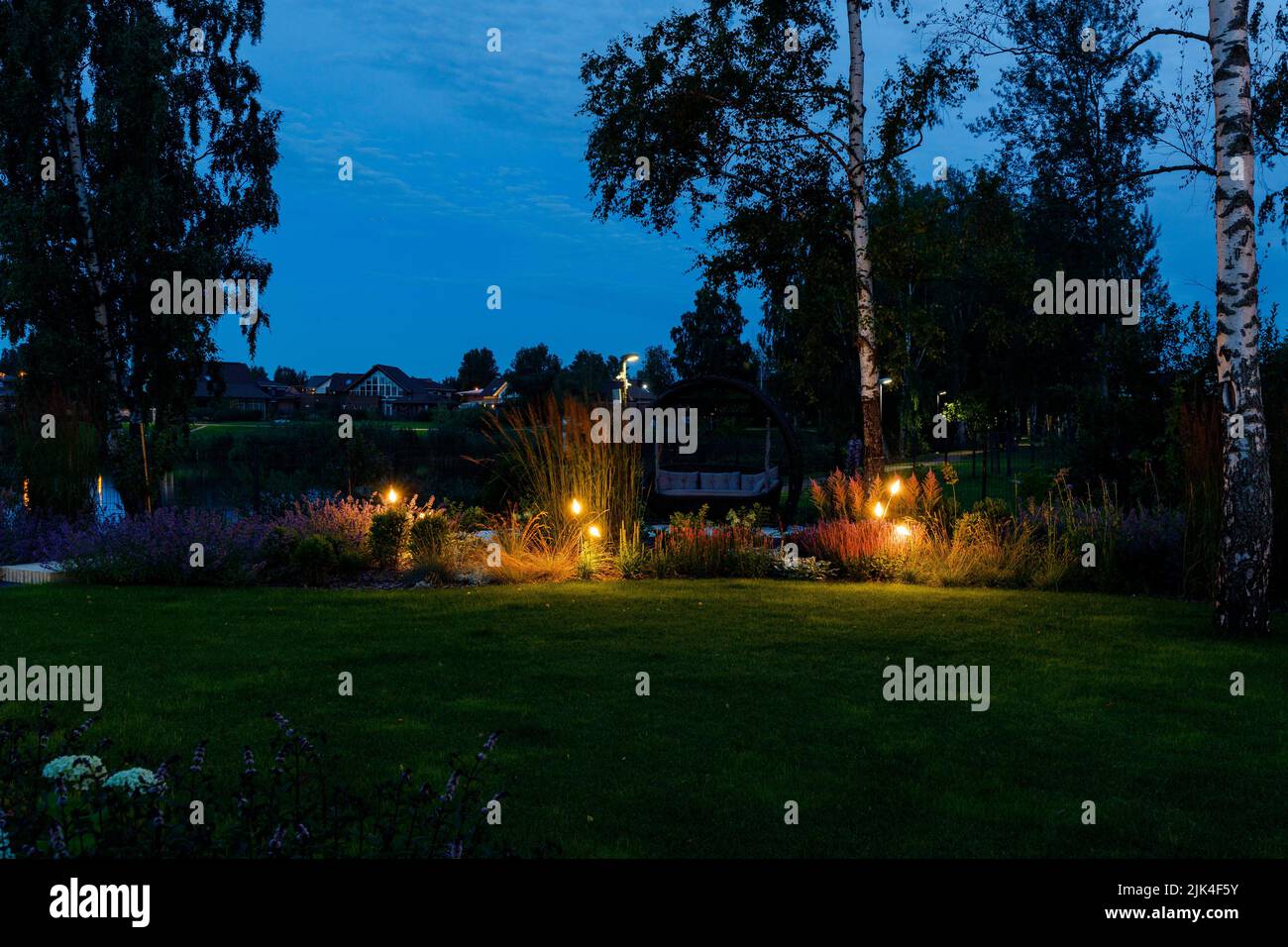Photo of lighting in the evening garden Stock Photo - Alamy