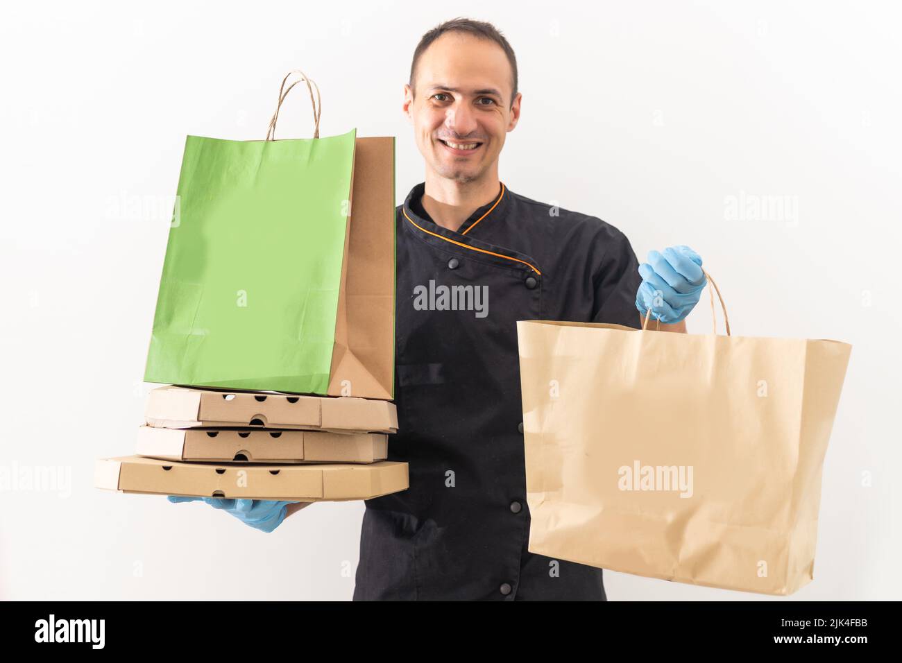 Food delivery in the restaurant. The chef packs food Stock Photo - Alamy