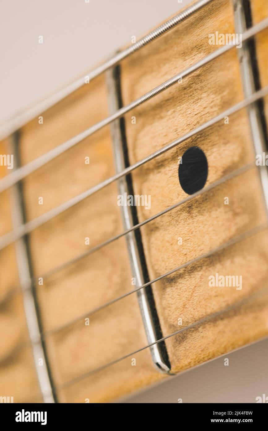 Vintage electric guitar fretboard with steel strings. Rock, blues ...