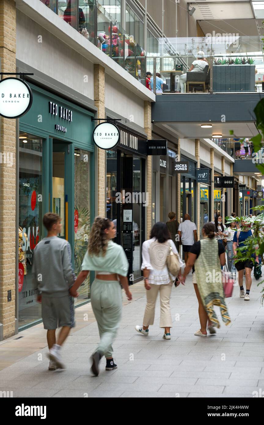 Interior of Westgate Shopping Centre with people walking past retail ...