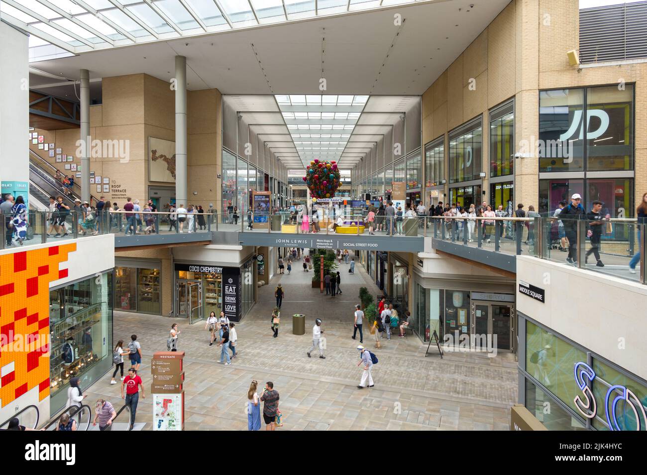 Interior of Westgate Shopping Centre with people walking past retail ...