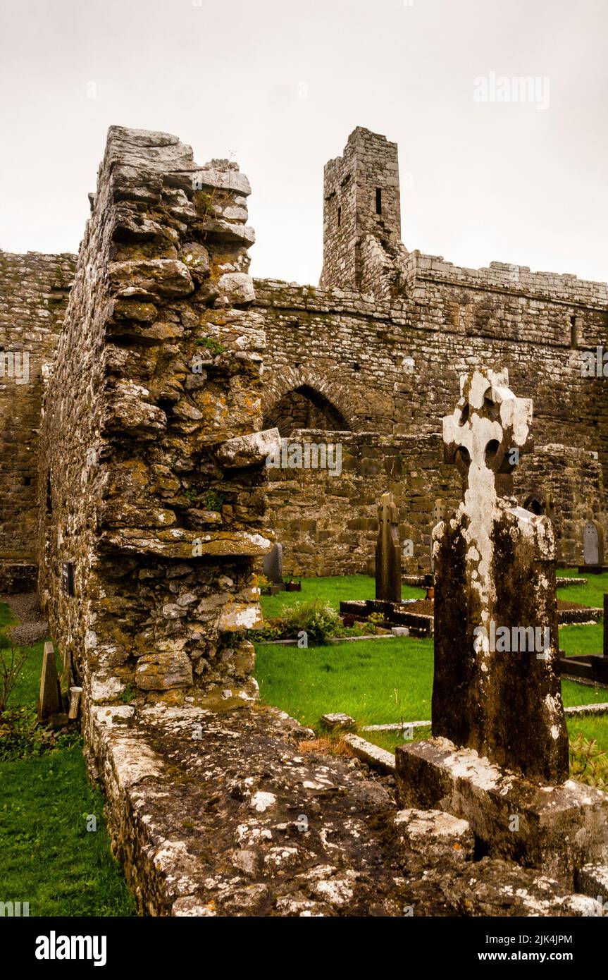High Cross, medieval tower and gothic pointed arch at Corcomroe Abbey ...