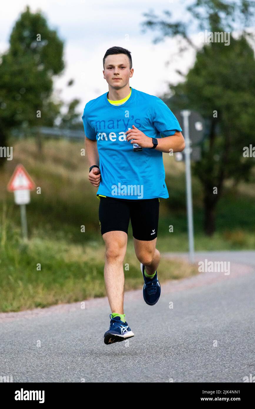 Berghaupten, Germany. 30th July, 2022. Denis Holub runs on a road after ...