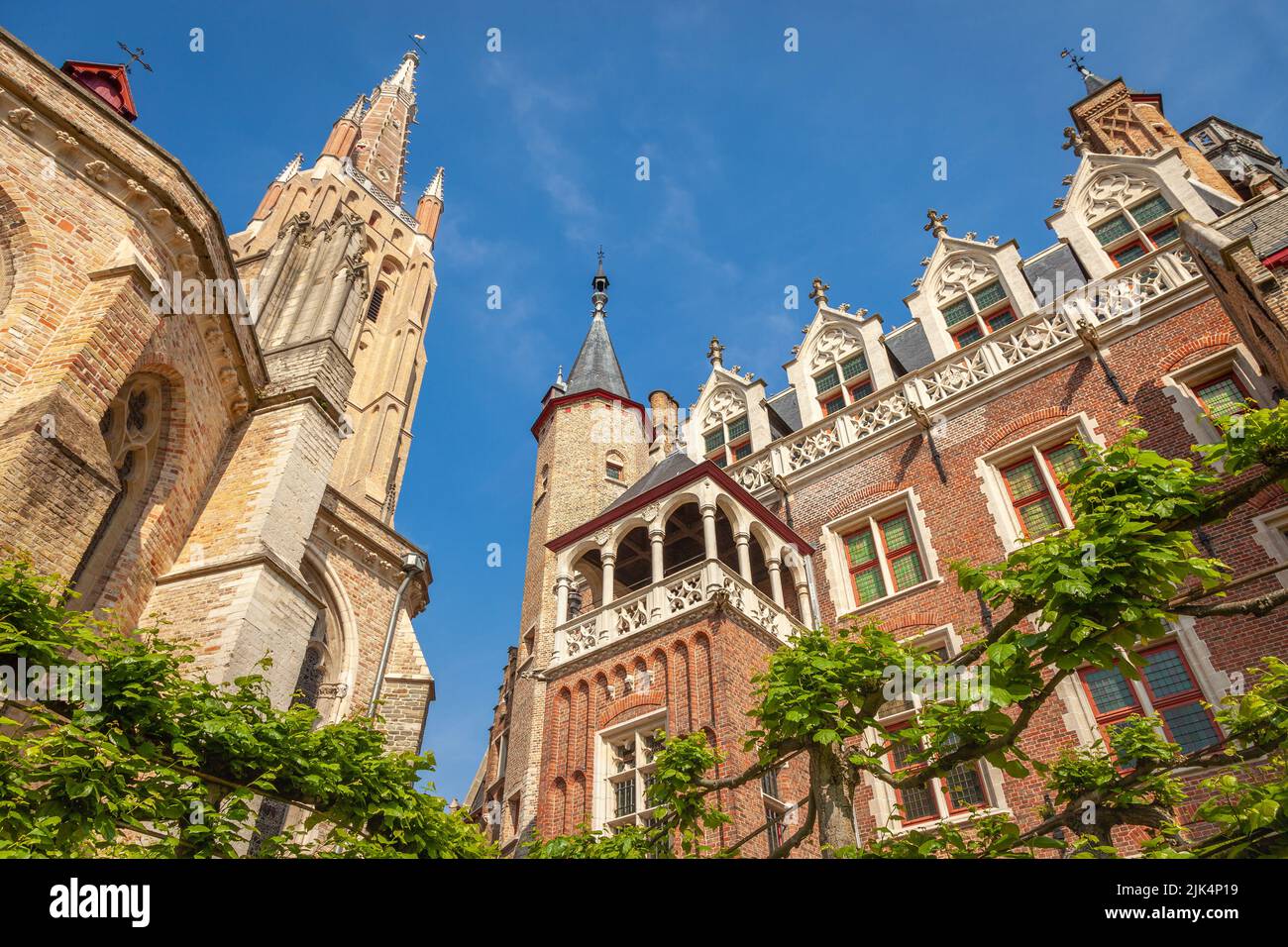 Church of our lady bell tower in Bruges at blue sky, Belgium Stock ...