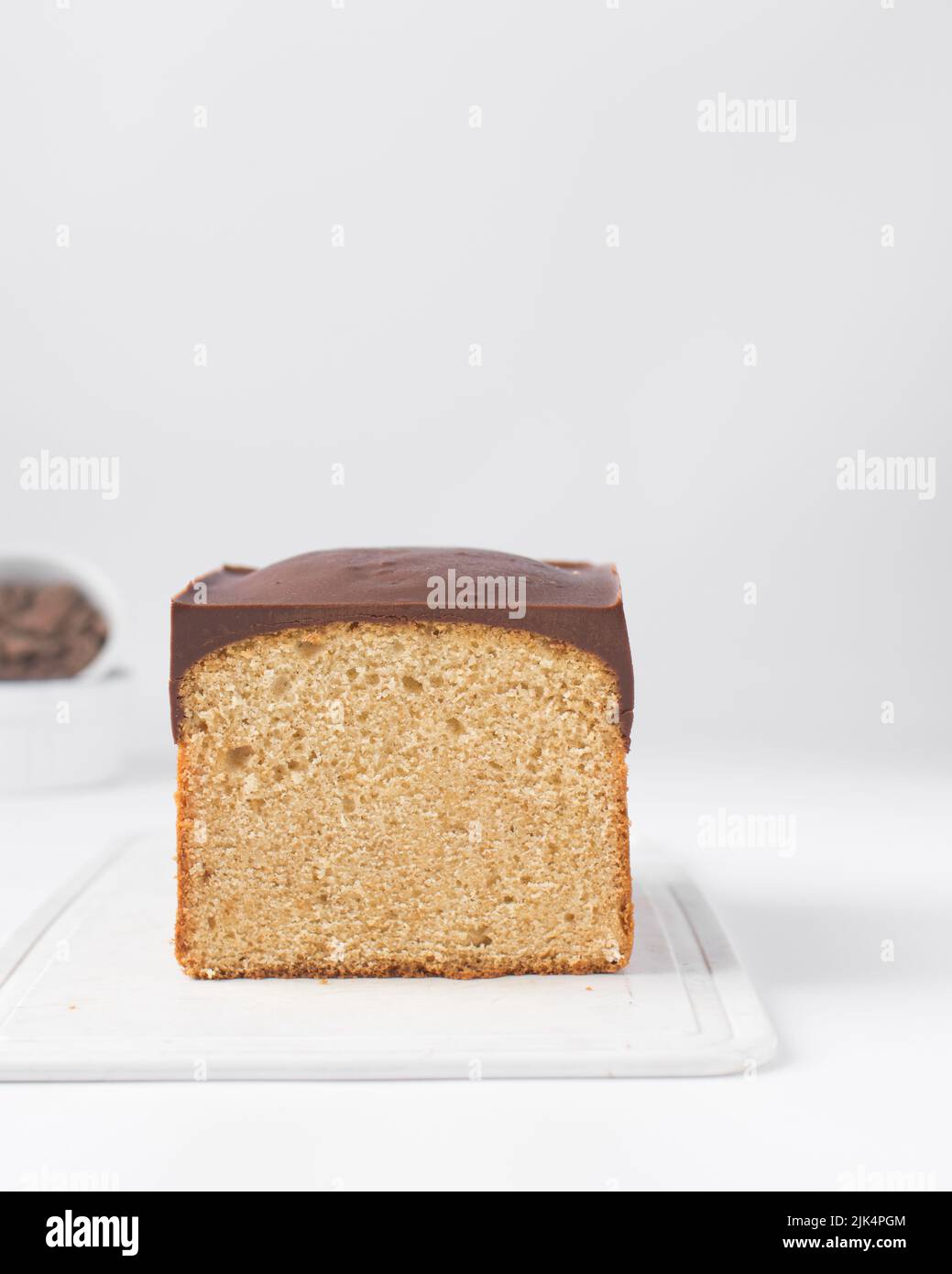 Vanilla pound cake loaf with a dark chocolate glaze topping Stock Photo ...