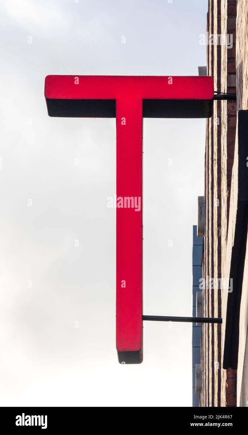 red single capital letter T sign on building in Liverpool Stock Photo ...