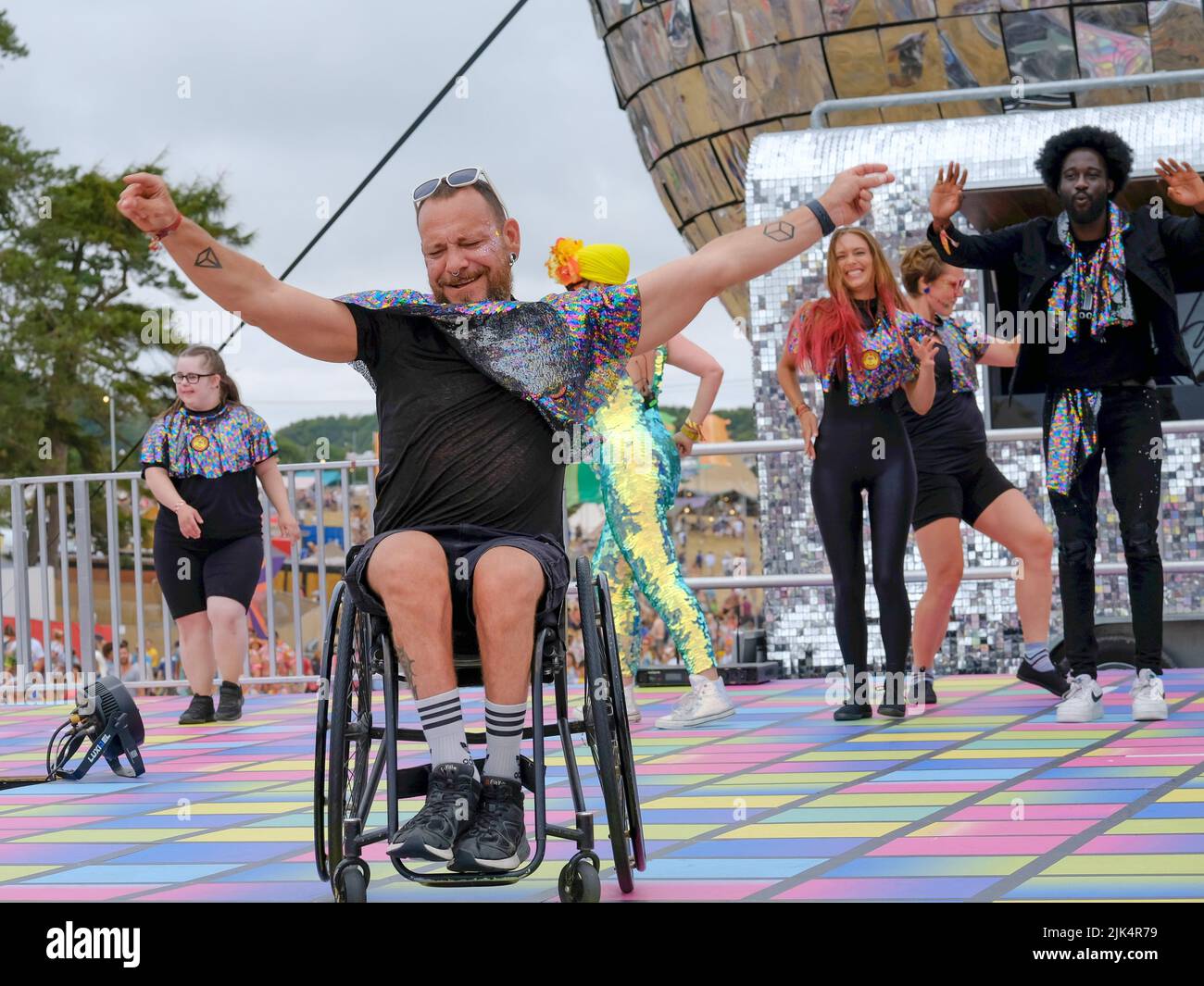 A member of dance troupe Diverse City in a wheel chair performs on a ...