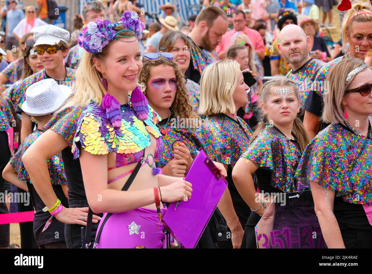 Crowd of people dance with dance troupe Diverse City as festival goers ...