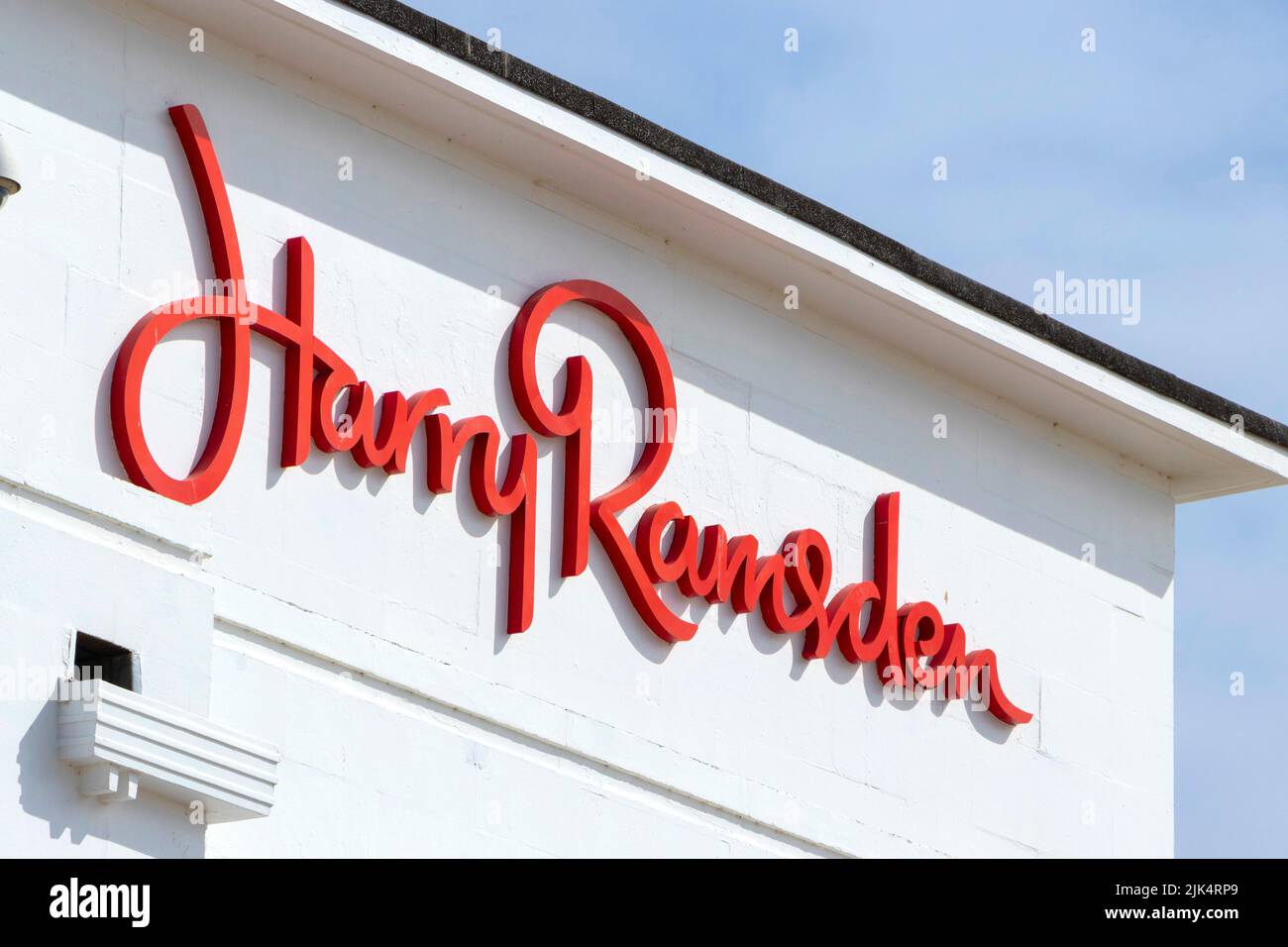 Harry Ramsden red script logo sign on sea front famous fish and chip ...
