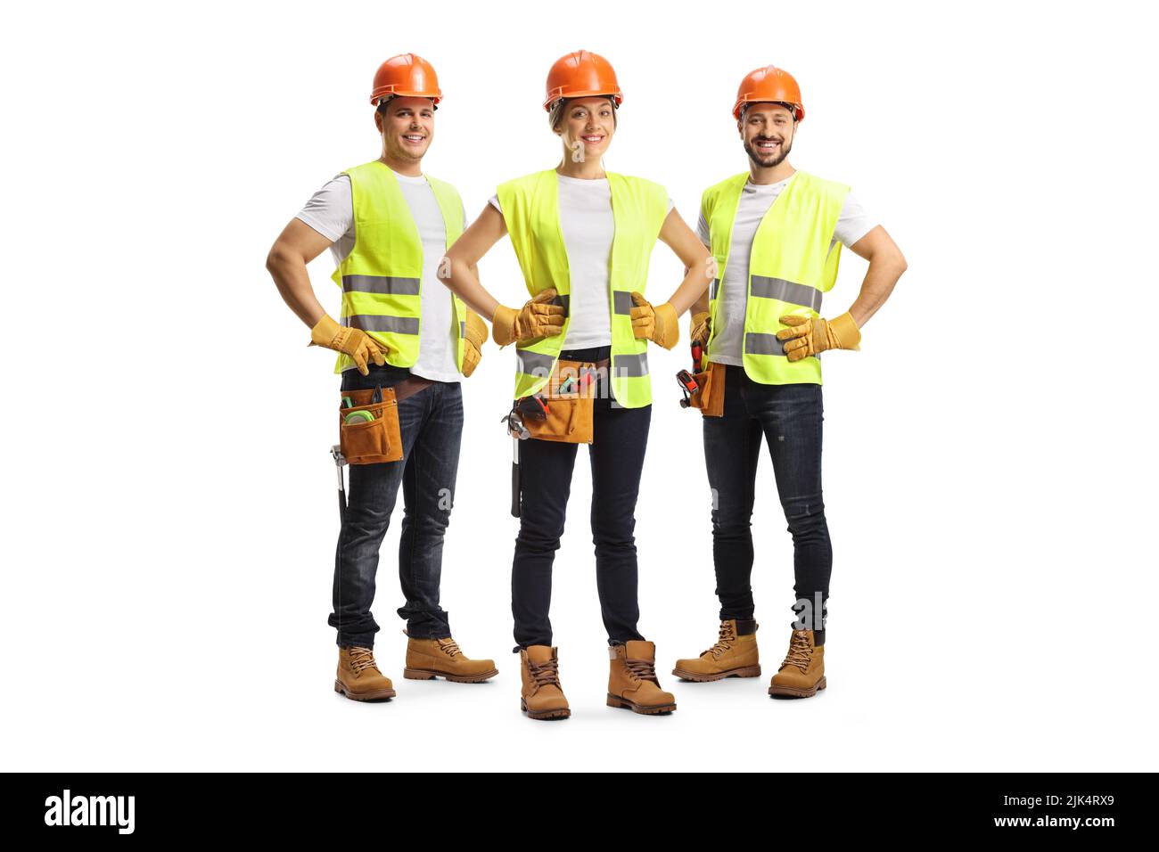 Full length portrait of site engineers wearing a tool belt and safety ...