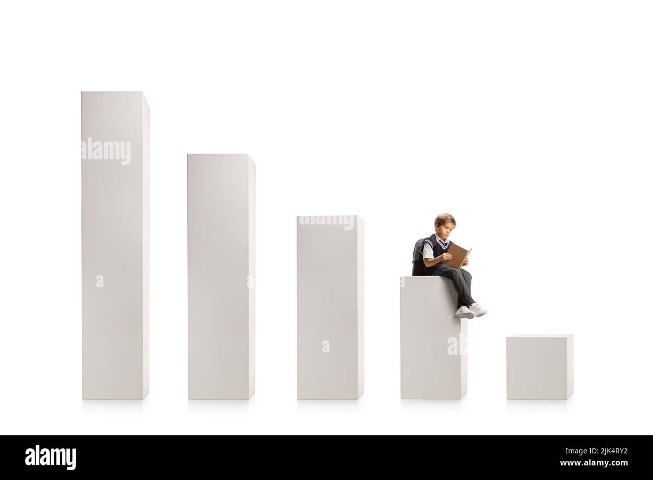 Schoolboy sitting on bar chart and reading a book isolated on white ...