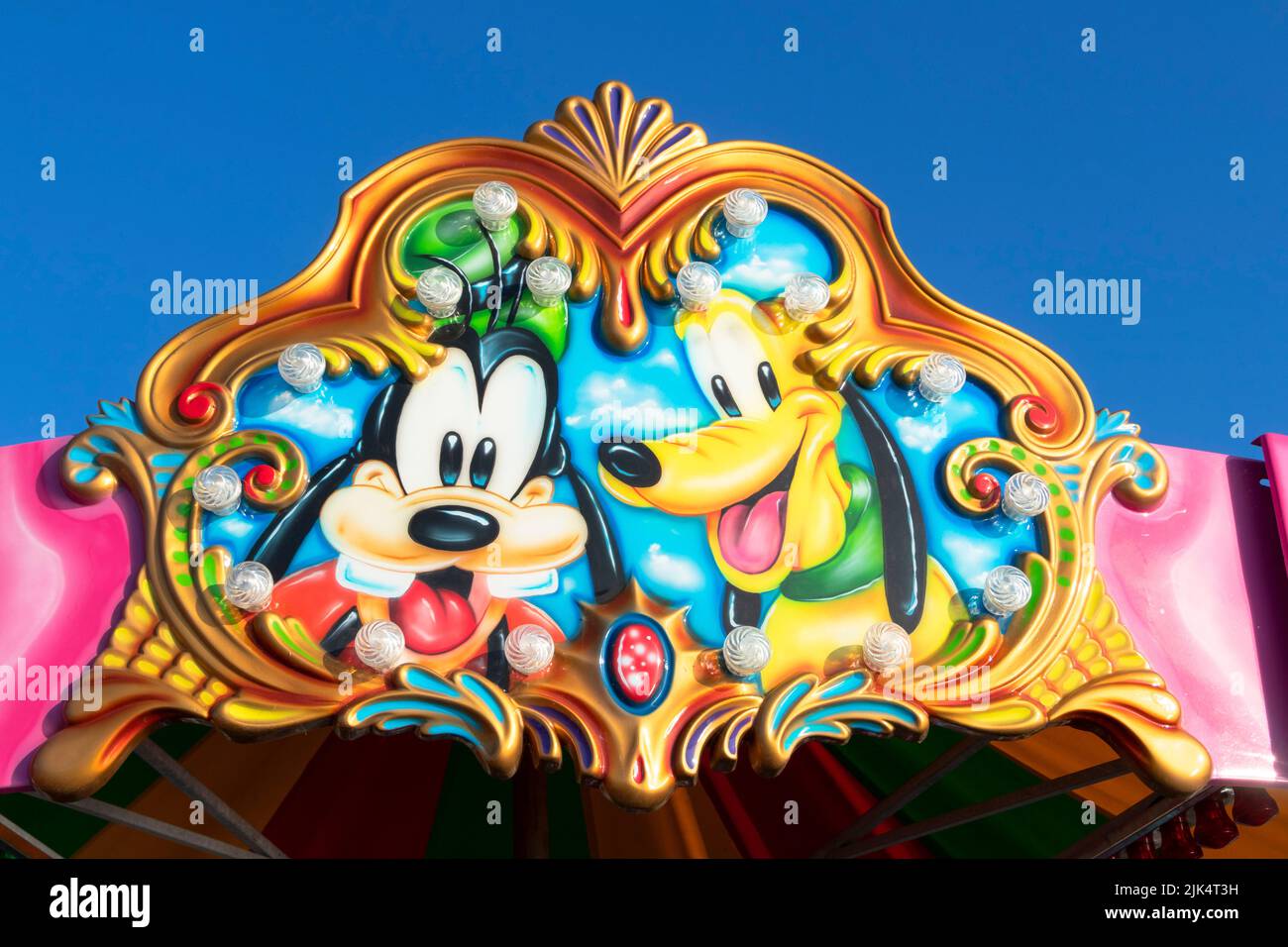 close up of painted Disney characters on the roundabout on the pier in ...