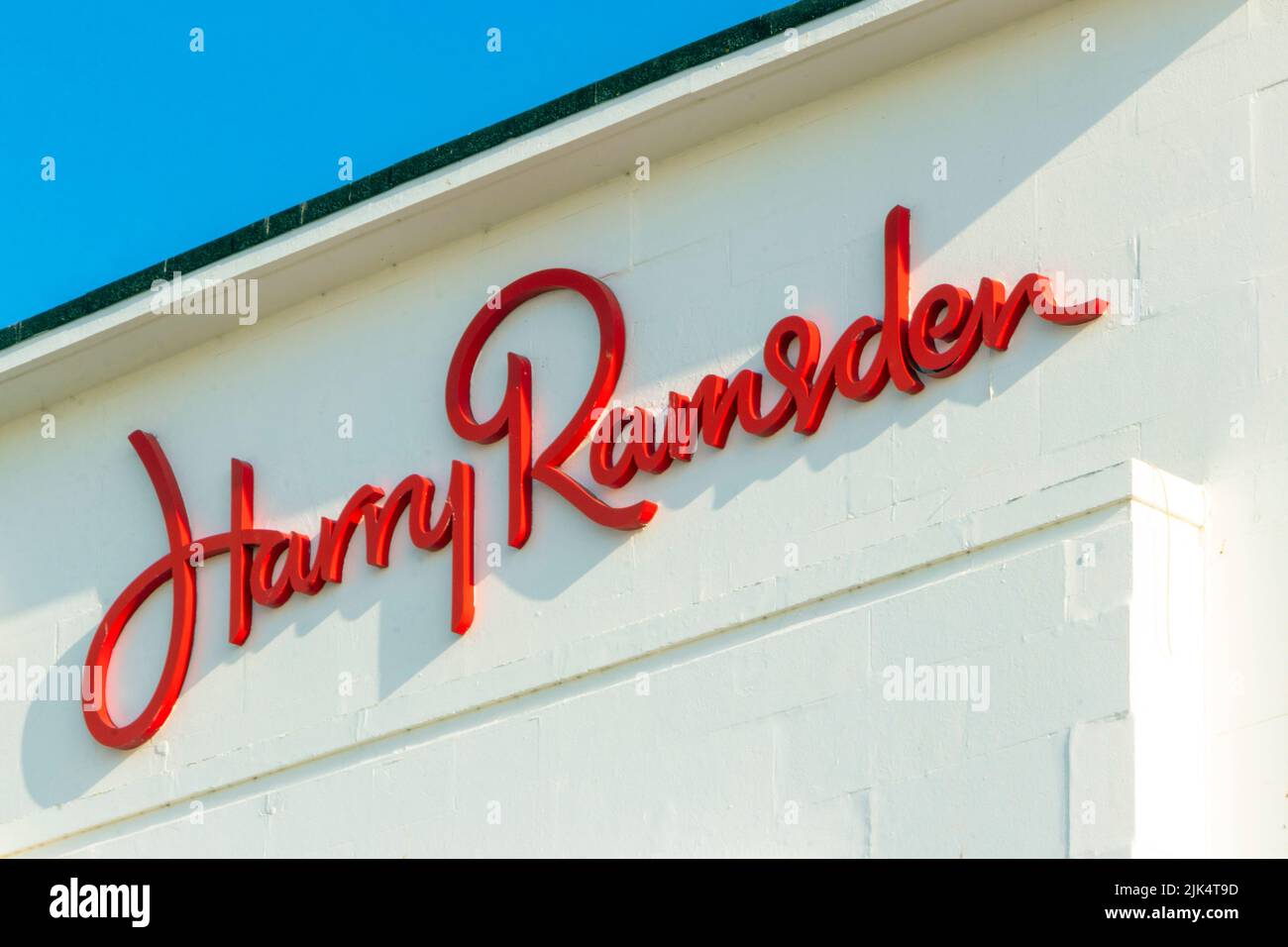 Harry Ramsden red script logo sign on sea front famous fish and chip ...