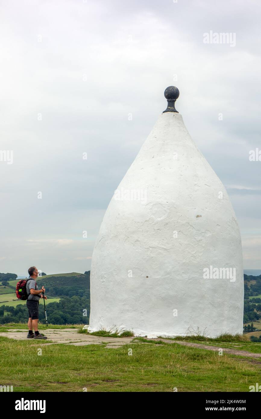 Man walking past the Cheshire landmark of White Nancy a structure on ...