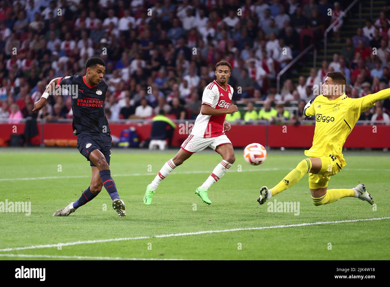 AMSTERDAM - (lr) Cody Gakpo of PSV Eindhoven scores the 2-3, Devyne ...