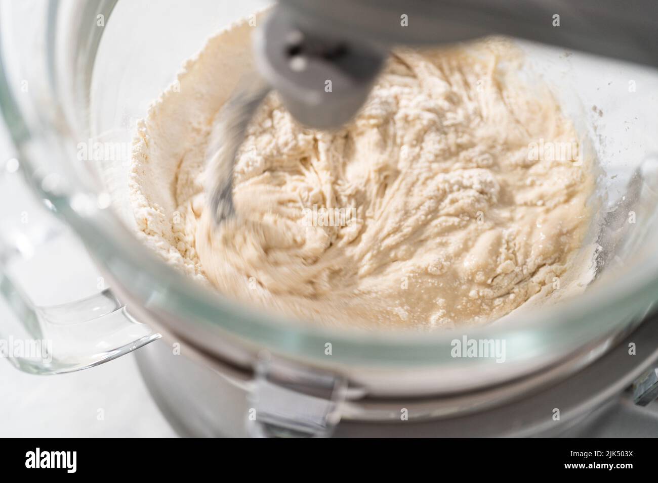 Mixing bread dough in a stand-alone kitchen mixer to bake patriotic ...